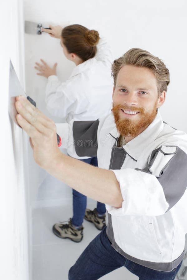 Smiling Worker Plastering Wall Stock Photo - Image of service ...