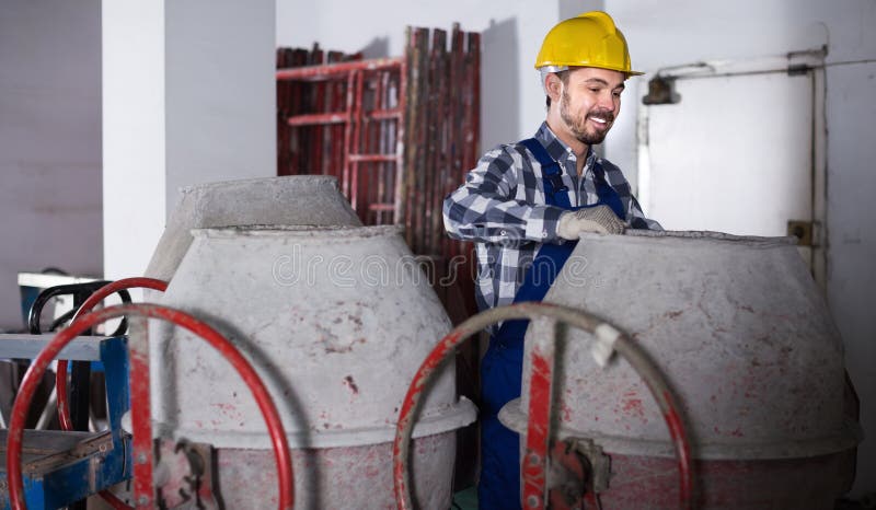Smiling Worker Using Concrete Mixer at Workplace Stock Image - Image of ...