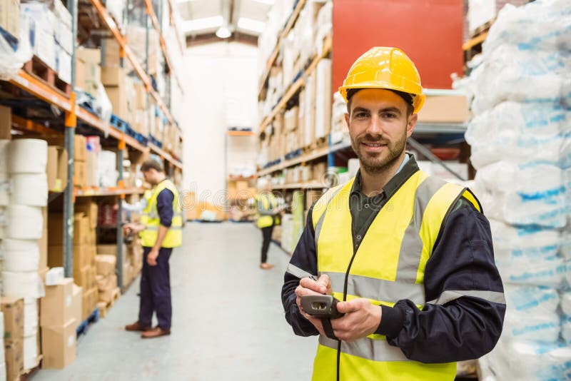 Smiling Worker Wearing Yellow Vest Using Handheld Stock Photo - Image ...