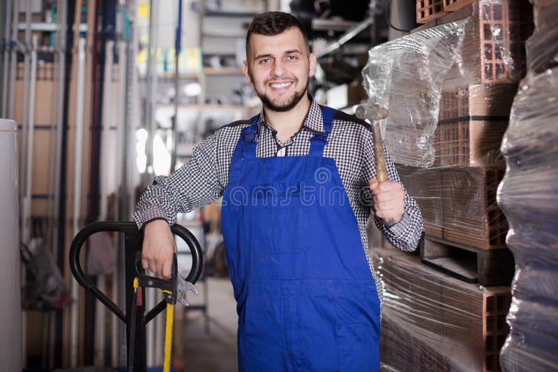 Smiling Working Male Demonstrating Various Tools Stock Image - Image of ...
