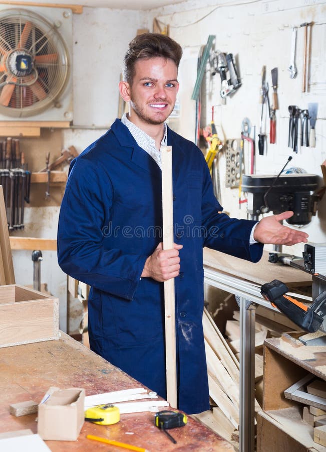 Working Man Examining Edging Strips To Finish Work Stock Image - Image ...