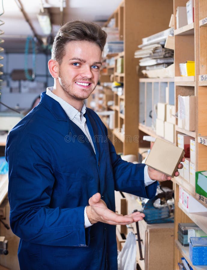Man Looking through Stored Items at Workshop Stock Image - Image of ...