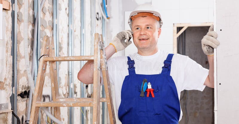 Smiling Workman Having Phone Conversation during Break in Work at ...