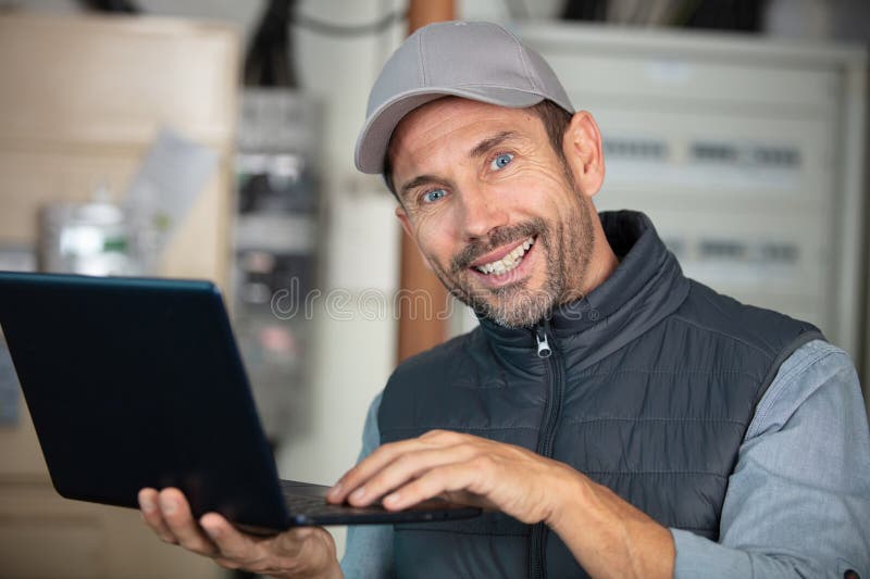 Smiling Workman Using Laptop he Holding Stock Photo - Image of manual ...