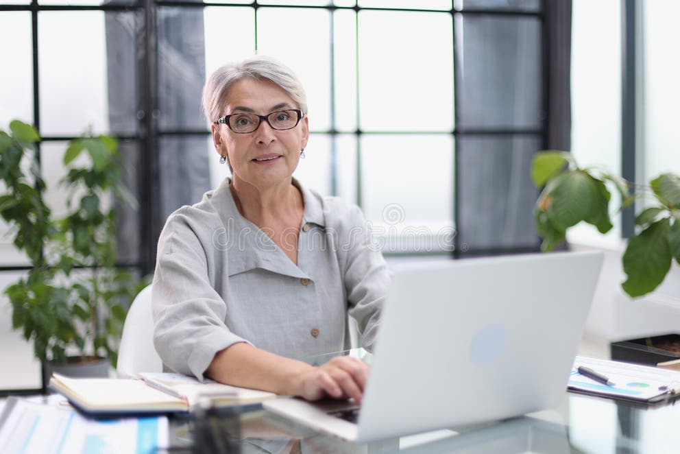 Smiling 60-year-old Business Lady Using a Computer Stock Image - Image ...