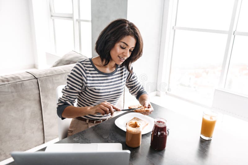 Smiling Young African Woman Having Breakfast Stock Photo - Image of ...