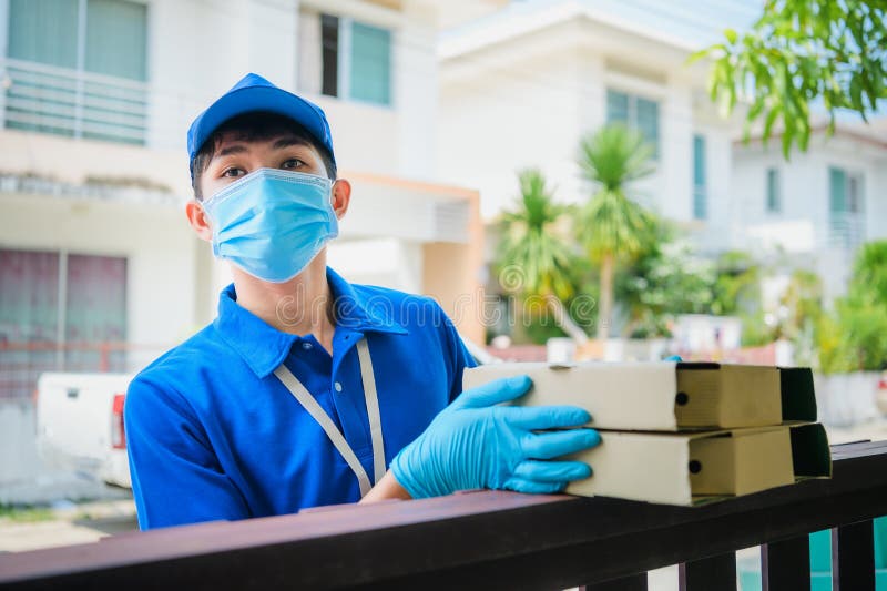 Delivery Man in Blue Uniform Stock Photo - Image of attractive, courier ...
