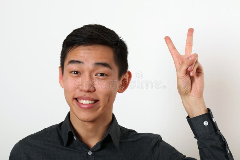 Smiling Young Asian Man Giving the Okay Sign and Looking at Came Stock ...