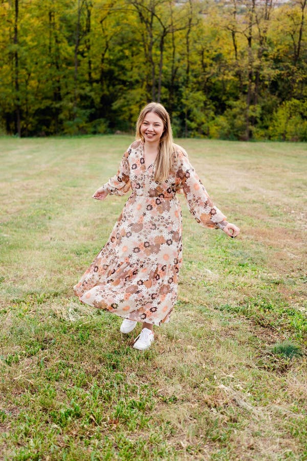 Smiling Young Beautiful Woman Walking in a Field Stock Image - Image of ...