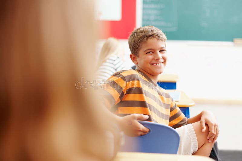 Get the Attention of the Cool Kid in Class. Smiling Young Boy Turning ...