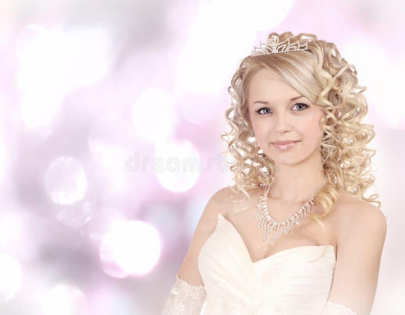 Happy Bride in a Veil Holding Her Bouquet Looking at Camera in the ...