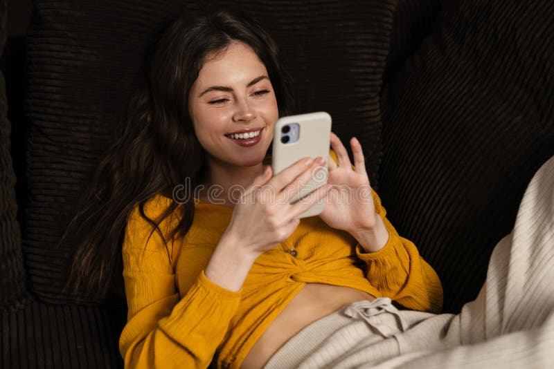 Smiling Young Brunette Woman Using Mobile Phone Stock Photo - Image of ...