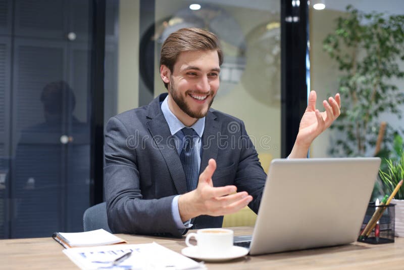 Smiling Young Business Man Having Video Call in Office Stock Photo ...