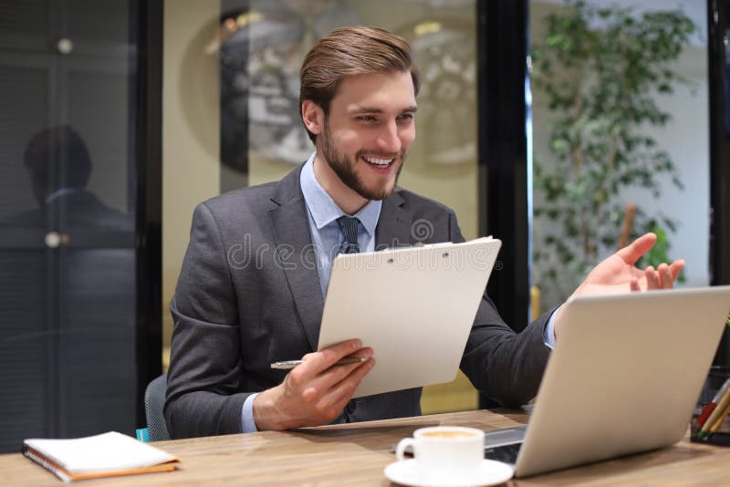 Smiling Young Business Man Having Video Call in Office Stock Photo ...
