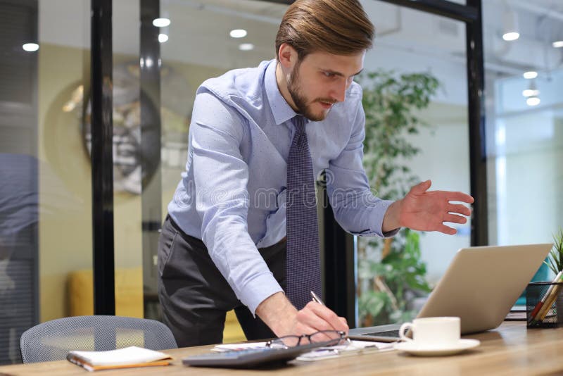 Smiling Young Business Man Having Video Call in Office Stock Photo ...