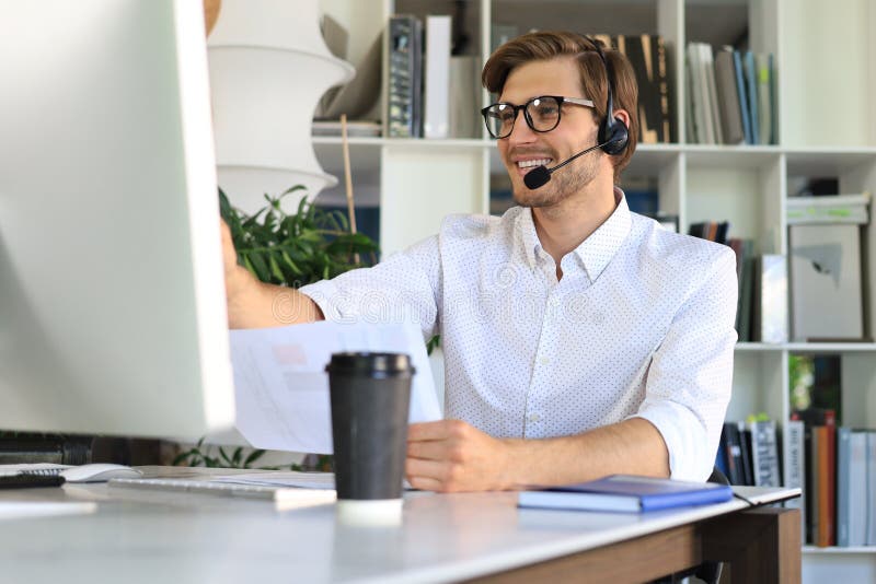 Smiling Young Business Man Having Video Call in Office. Stock Photo ...
