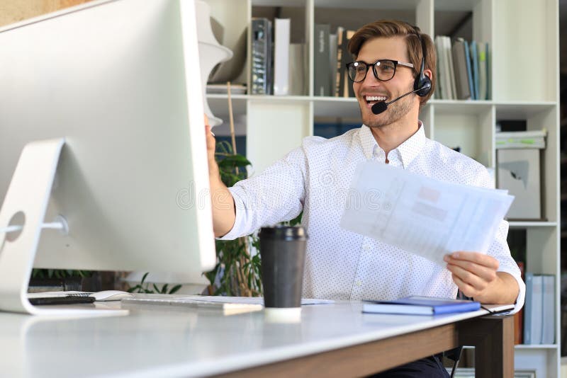 Smiling Young Business Man Having Video Call in Office. Stock Photo ...
