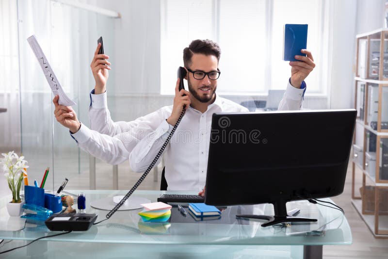 Young Businessman Doing Multitasking Work Stock Image - Image of ...