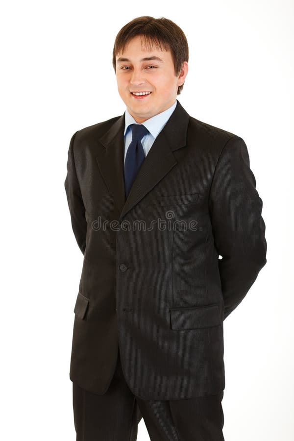 Smiling Young Businessman With Hands Behind Back Stock Photo - Image of ...