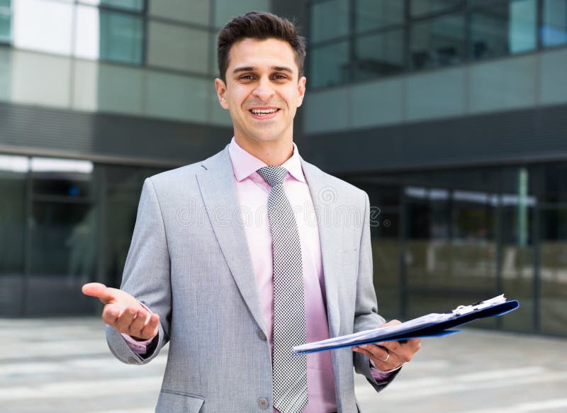 Smiling Businessman Welcoming Partners Stock Image - Image of document ... Smiling Businessman Welcoming Partners Stock Image - Image of document ...