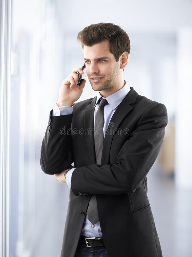 Smiling Young Businessman Talking on Mobile Phone Stock Photo - Image ...