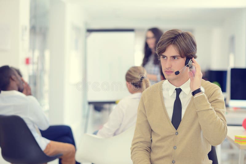 Smiling Young Call Center Executive at Startup Office Stock Image ...