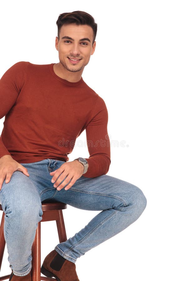 Smiling Young Casual Man Sitting on a Stool Stock Image - Image of hold ... Smiling Young Casual Man Sitting on a Stool Stock Image - Image of hold ...