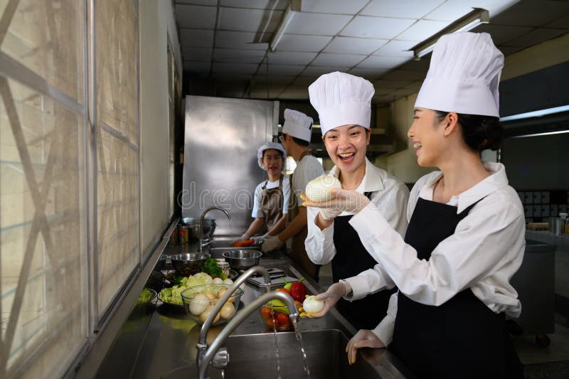 Smiling Young Chefs Learning Kitchen Hygiene Teamwork Professional Cooking School Stock Photos ...