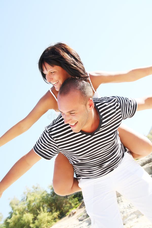 Smiling Young Couple Having Fun at the Beach Stock Image - Image of ...