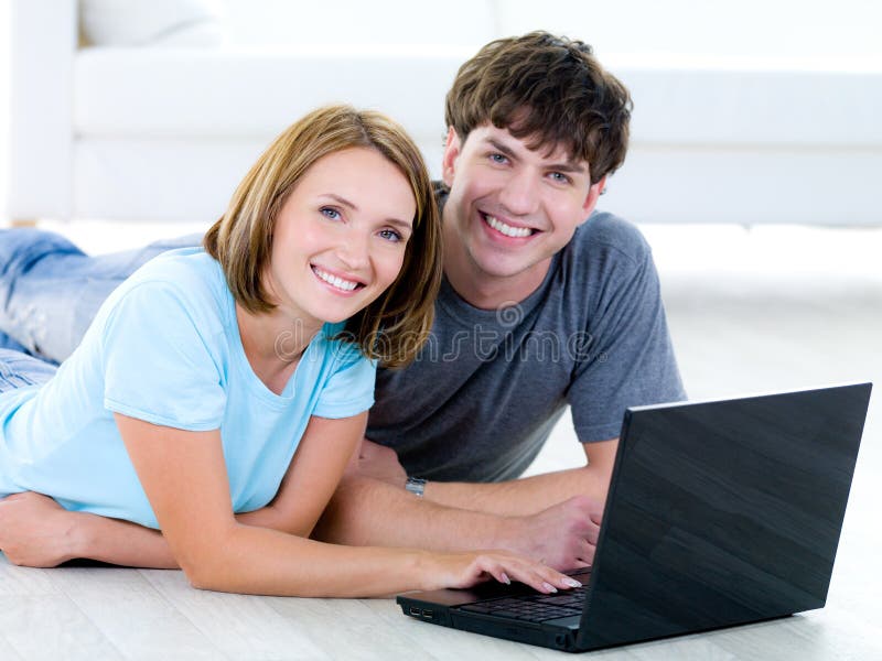 Couple using Laptop stock image. Image of notebook, internet - 771821