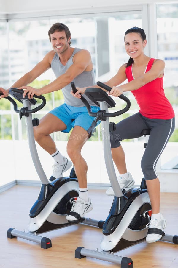 Smiling Young Couple Working Out at Spinning Class Stock Photo - Image ...