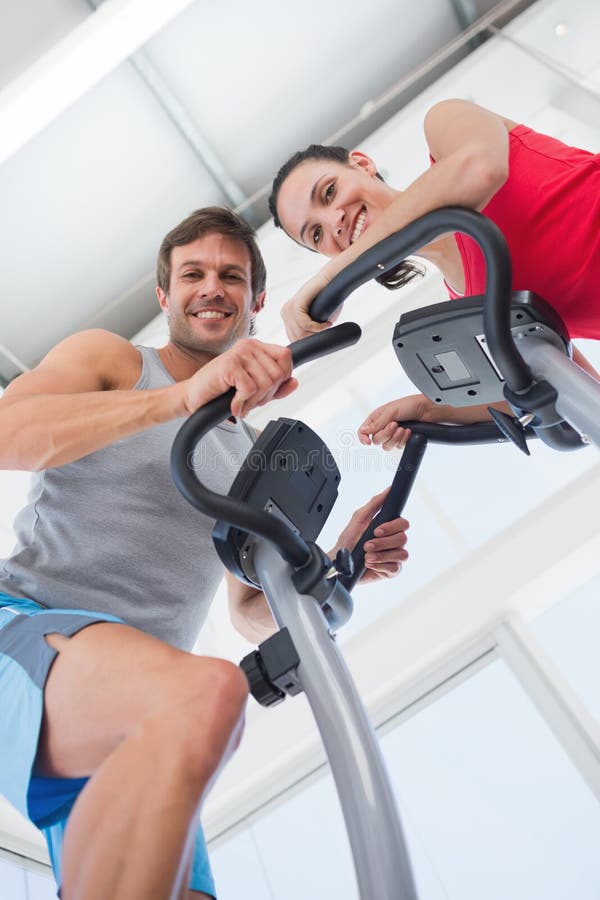 Smiling Young Couple Working Out at Spinning Class Stock Photo - Image ...