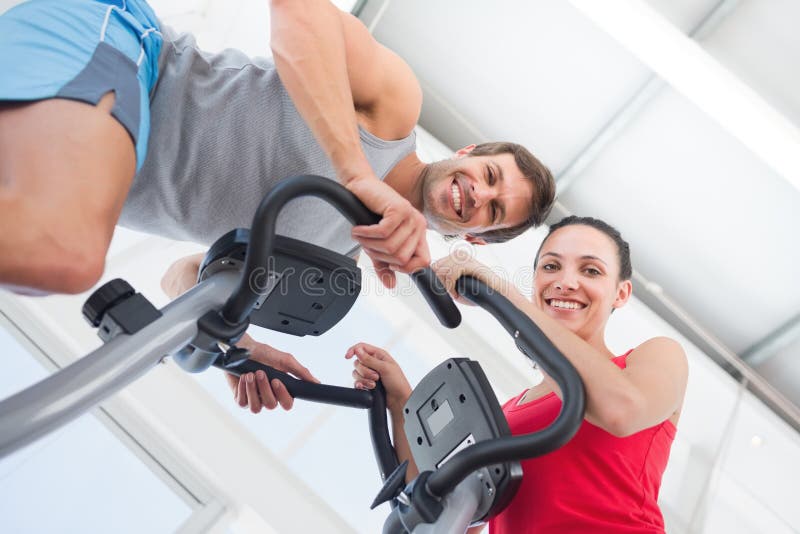 Smiling Young Couple Working Out at Spinning Class Stock Photo - Image ...