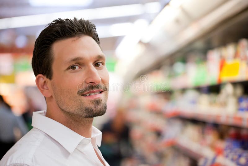 Smiling Young Customer at Supermarket Stock Photo - Image of caucasian ...