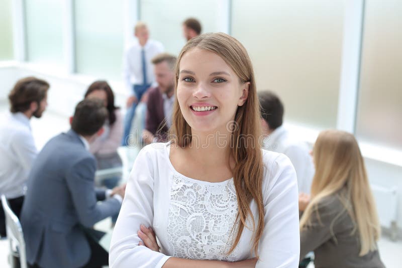 Smiling Young Employee Standing in Business Office. Stock Photo - Image ...