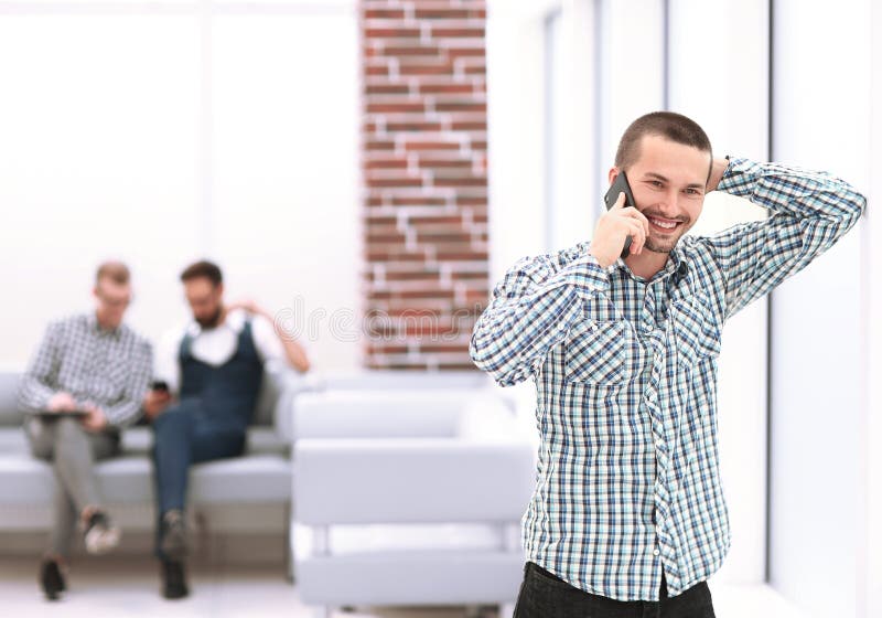 Smiling Young Employee Standing in the Office Stock Photo - Image of ...