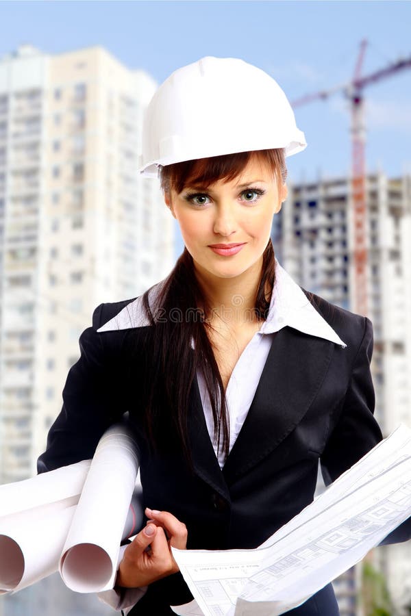 Smiling Young Female Architect Stock Photo - Image of hardhat, table ...