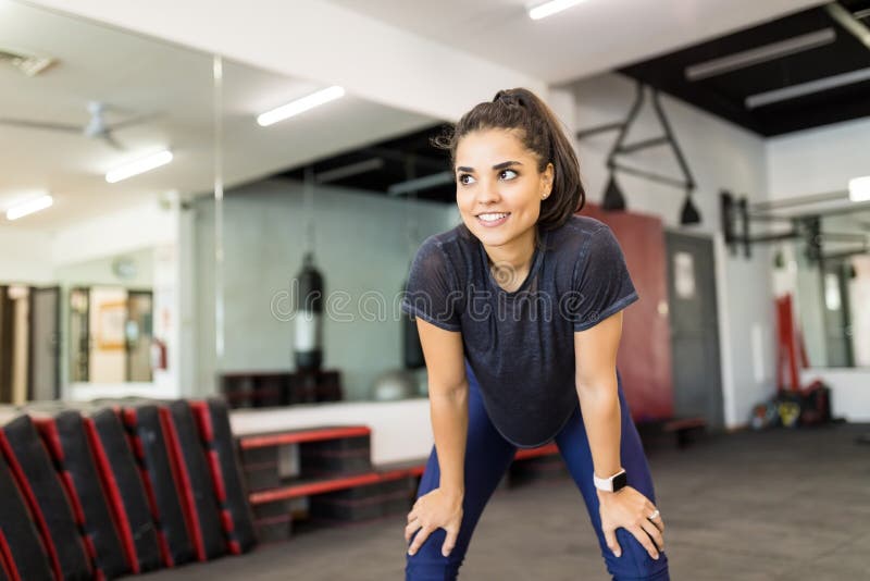 Smiling Female Athlete Relaxing after Exercise in Gym Stock Image ...