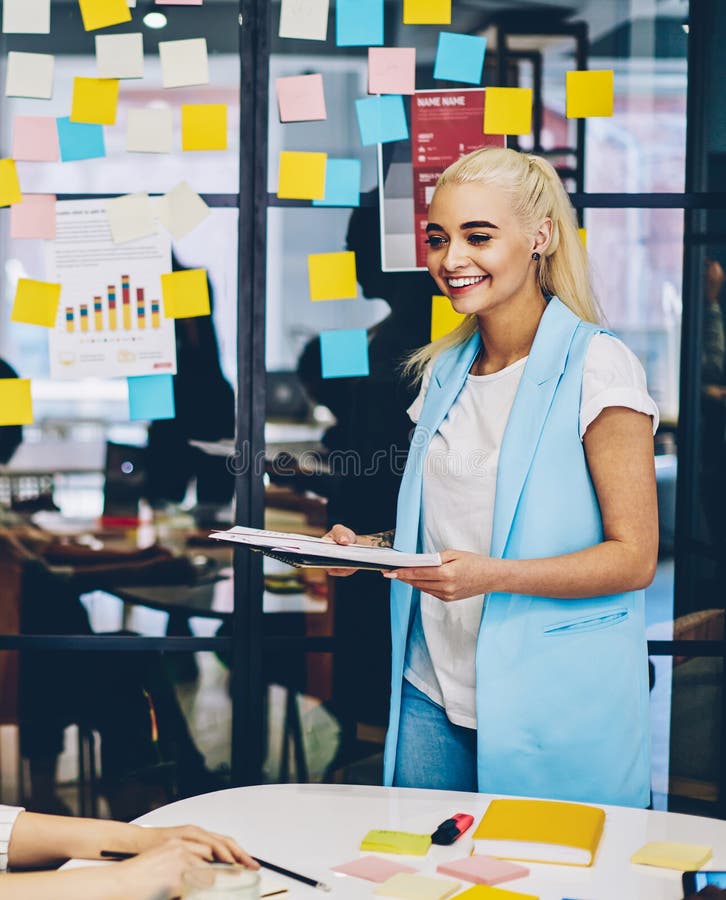 Smiling Young Female Coach Communicating with Multiracial Students ...