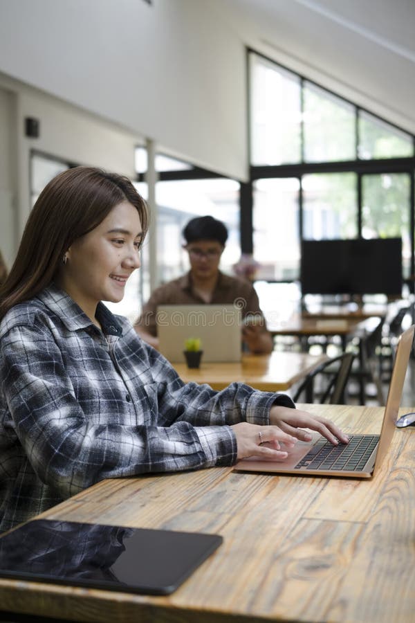 Smiling Female Designer Working with Computer Laptop in Creative Office ...