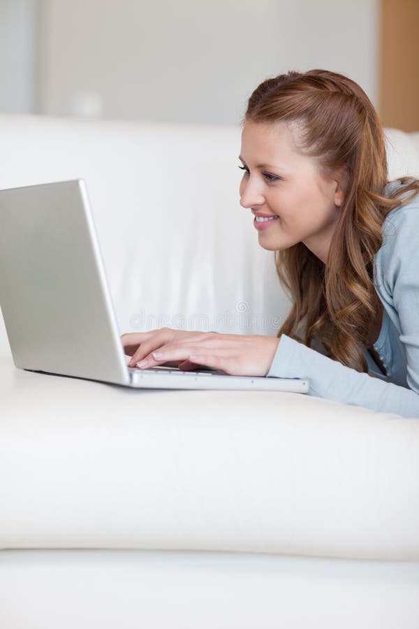 Young Woman Working on Laptop in Loft Apartment Stock Photo - Image of ...