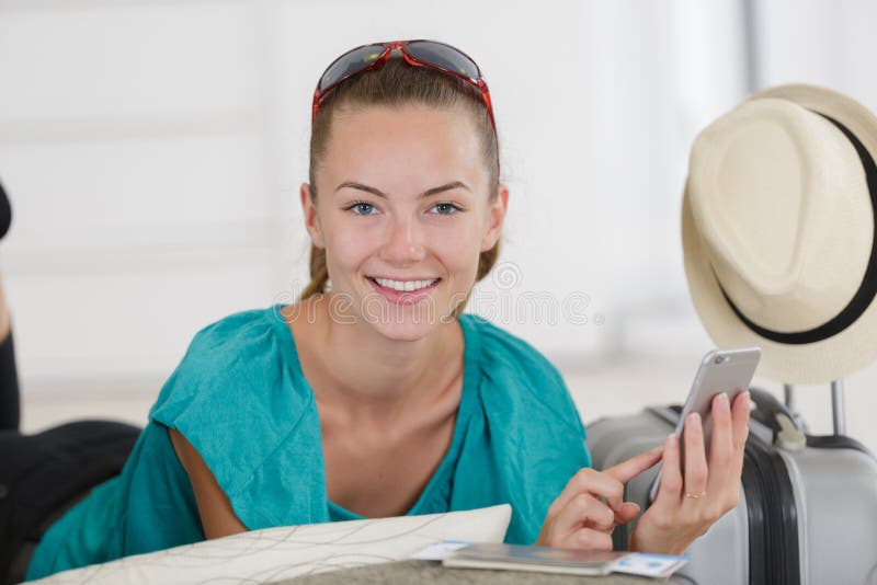 Smiling Young Female Using Phone on Sofa Stock Image - Image of relax ...