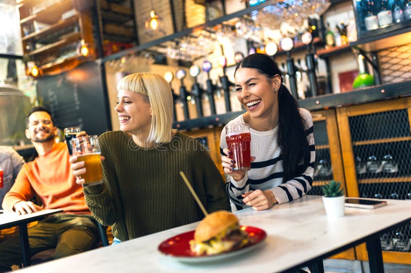 Young Friends Drinking Craft Beer in Pub Stock Image - Image of drink ...
