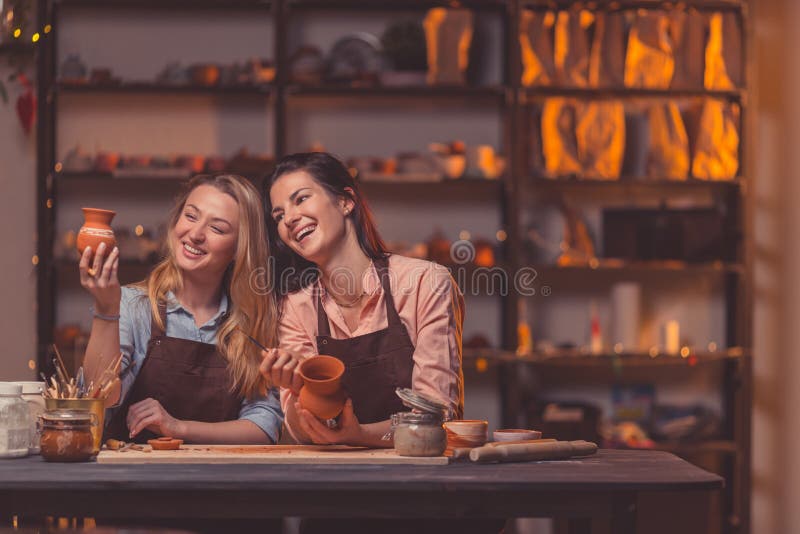 Young Smiling Girls at Work Indoors Stock Image - Image of pottery ...