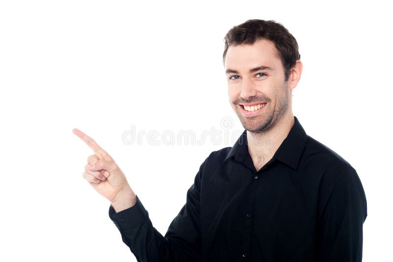 Smiling Young Guy Pointing at Something Stock Photo - Image of casual ...