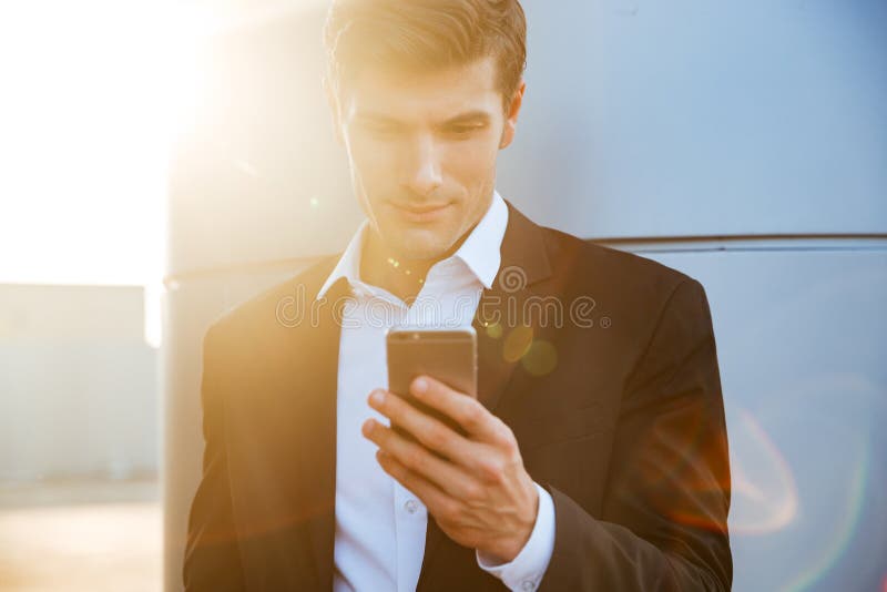 Smiling Young Handsome Businessman Using Mobile Phone Outdoors Stock ...