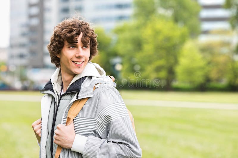 Smiling Young Male University Student at College Campus Stock Image ...