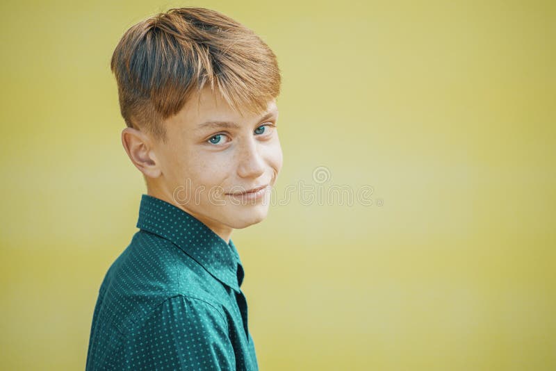 Smiling Young Man in Blue Shirt on Yellow Background Stock Photo ...