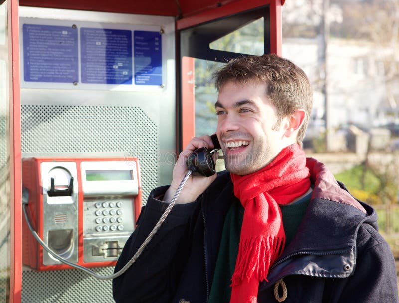 Smiling Young Man Calling from Phone Box Stock Image - Image of cabin ...