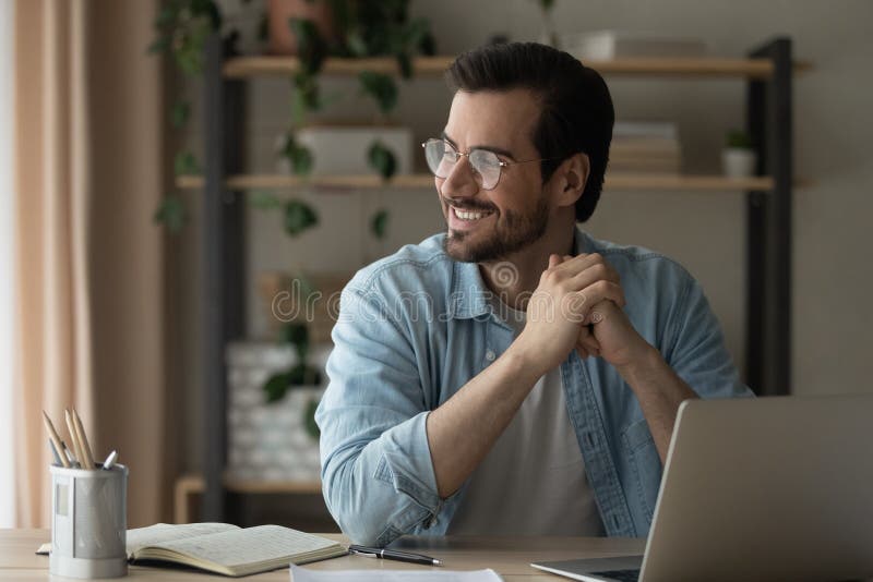 Smiling Young Man in Eyeglasses Distracted from Computer Work. Stock ...